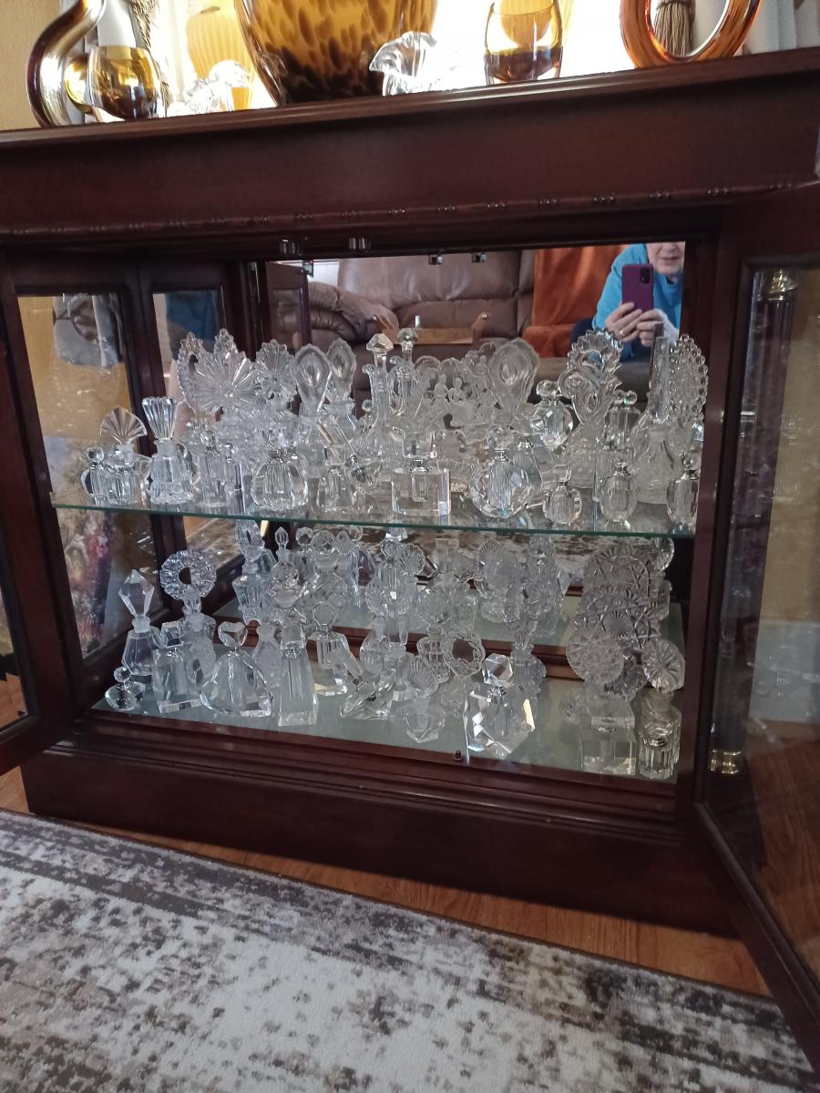 Cherry Curio Cabinet with perfume bottles | snaplist