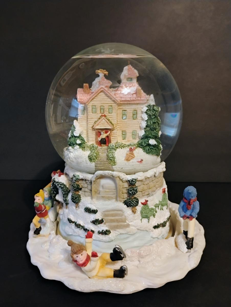 CHRISTMAS THEMED MUSICAL SNOW GLOBE WITH ROTATING SKATERS | snaplist